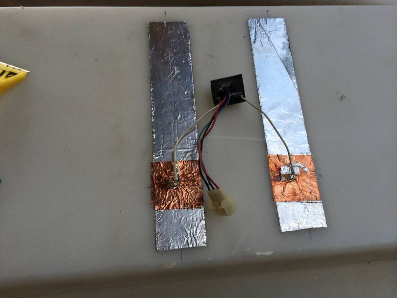 The sensor is soldered to copper foil which is stuck to aluminum foil