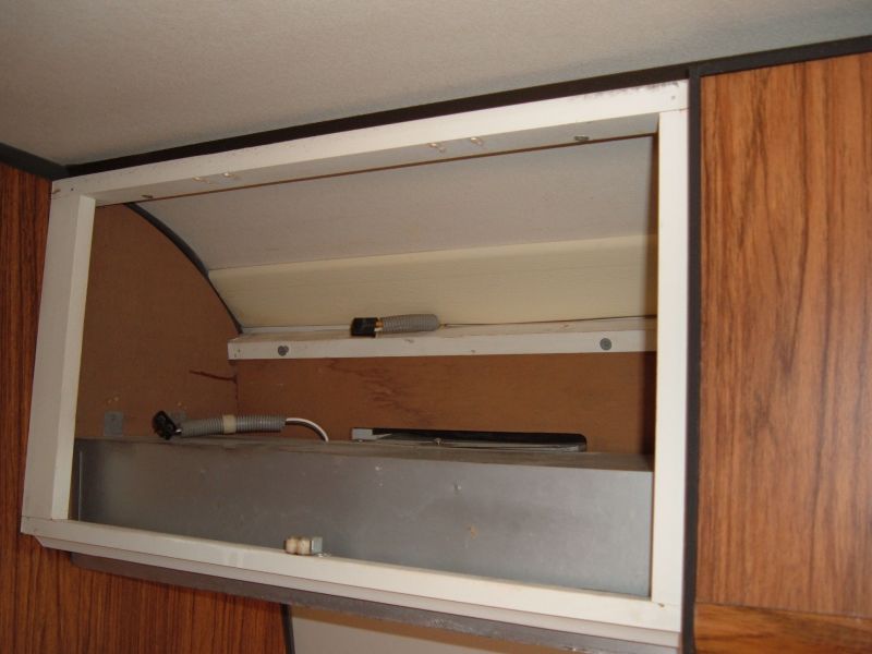 Upper Cupboard with Old Fan and Light Box